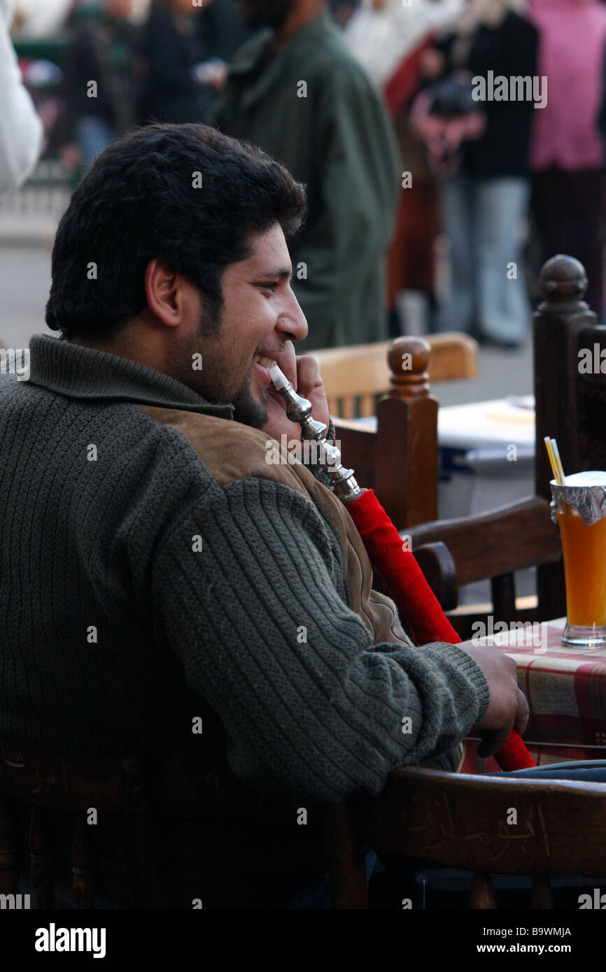 A man smoking a pipe in a cafe in Cairo in Egypt Stock Photo - Alamy