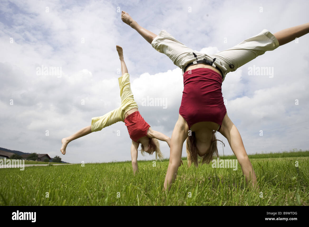 Girl doing a cartwheel hi-res stock photography and images - Alamy