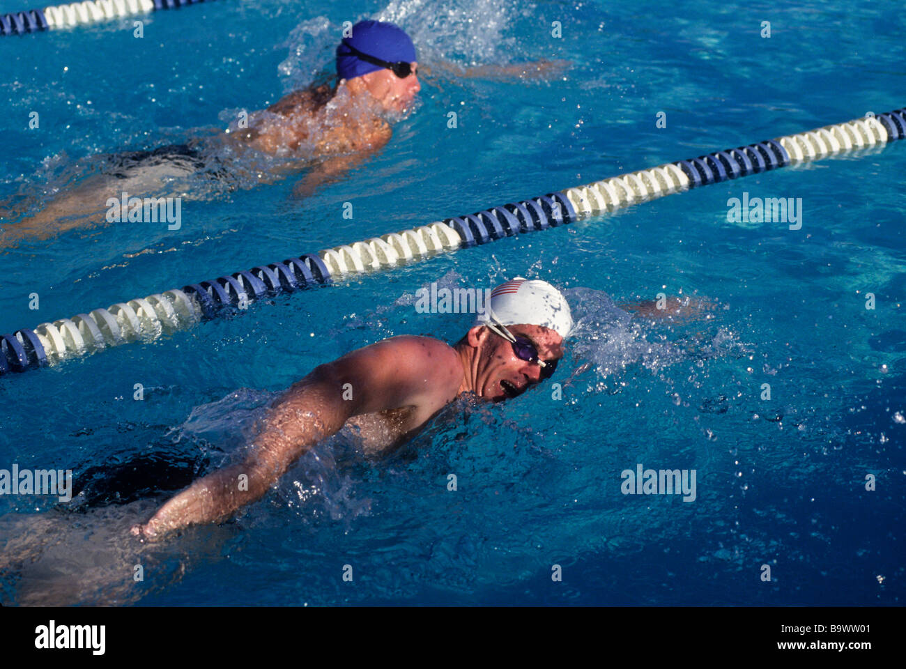 Swimmers competing in pool race hi-res stock photography and images - Alamy