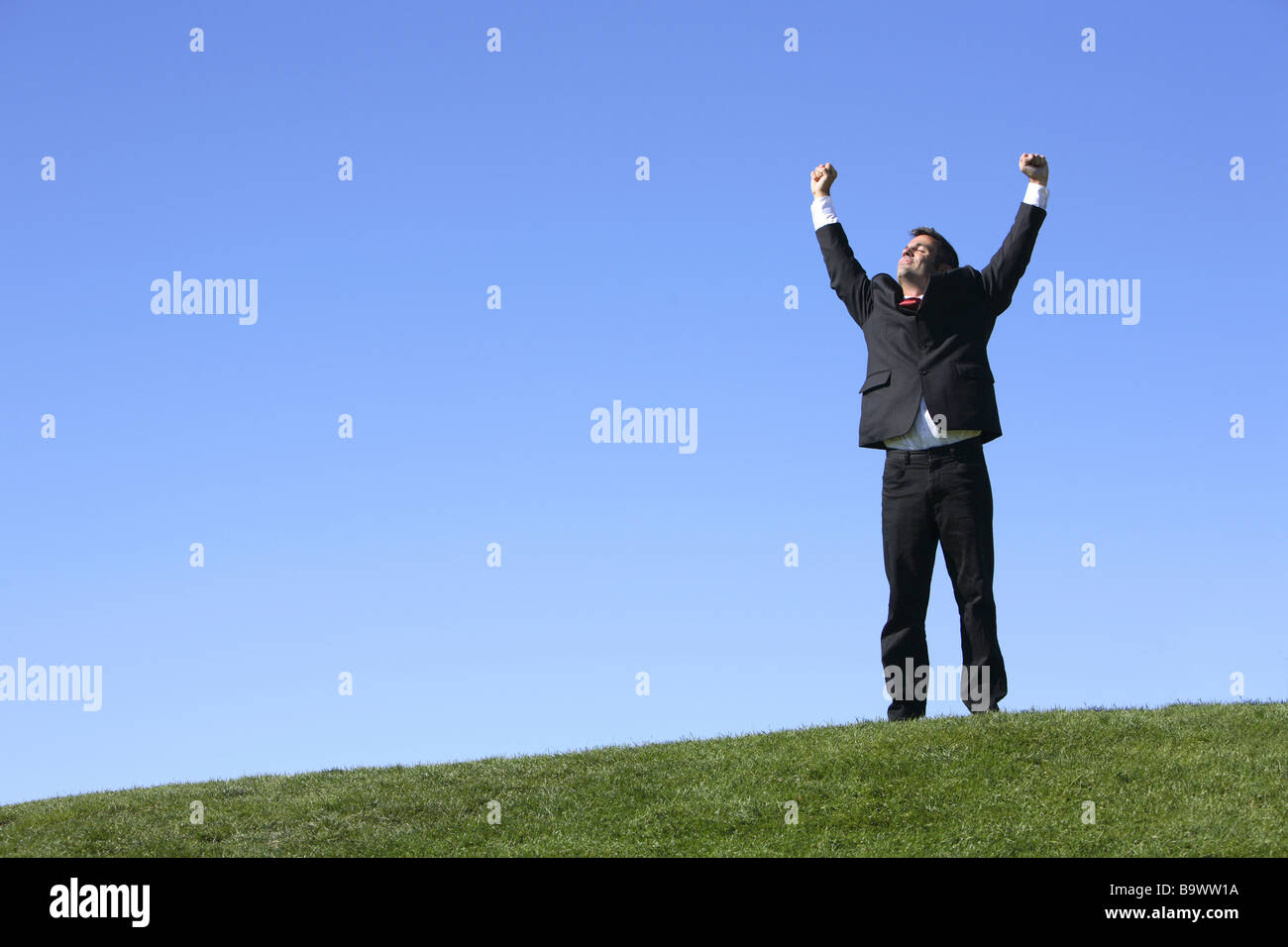 Man with raised arms hi-res stock photography and images - Alamy