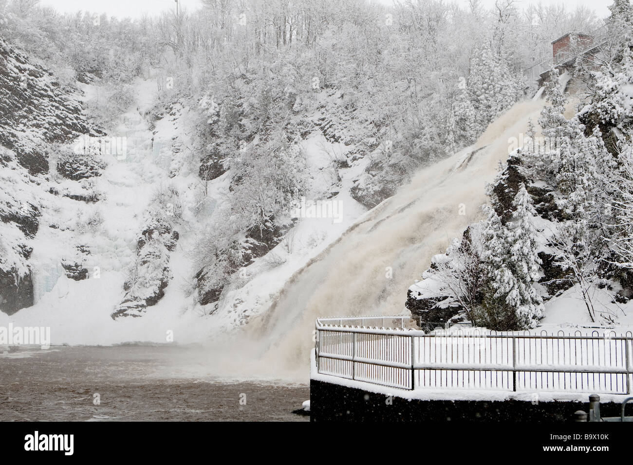 Heavy snow falls over the Parc des Chutes (waterfalls park) and the ...