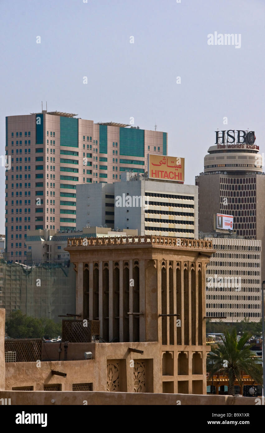 View of traditional wind towers in Burj Dubai with modern Deira area in ...