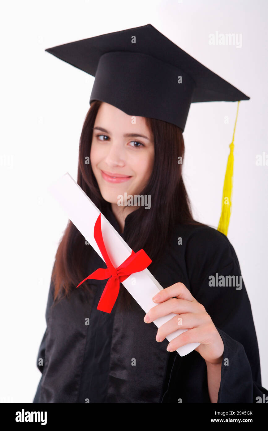 One single woman wearing graduation gown holding certificate smiling ...