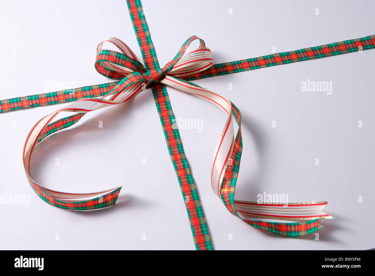 Wrapped gift with bow Stock Photo - Alamy