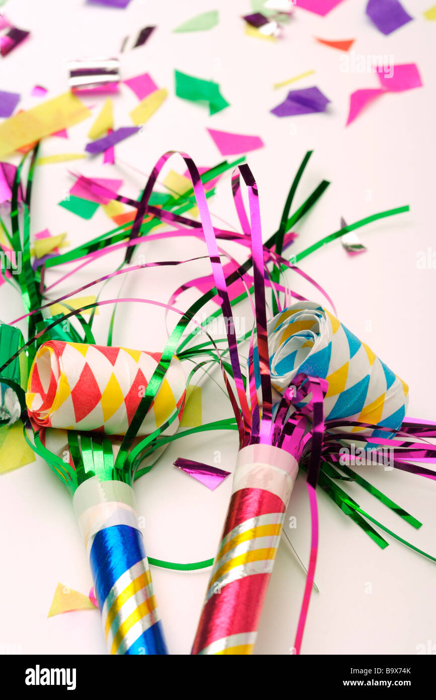 Party Horn Blowers and paper decoration Stock Photo - Alamy