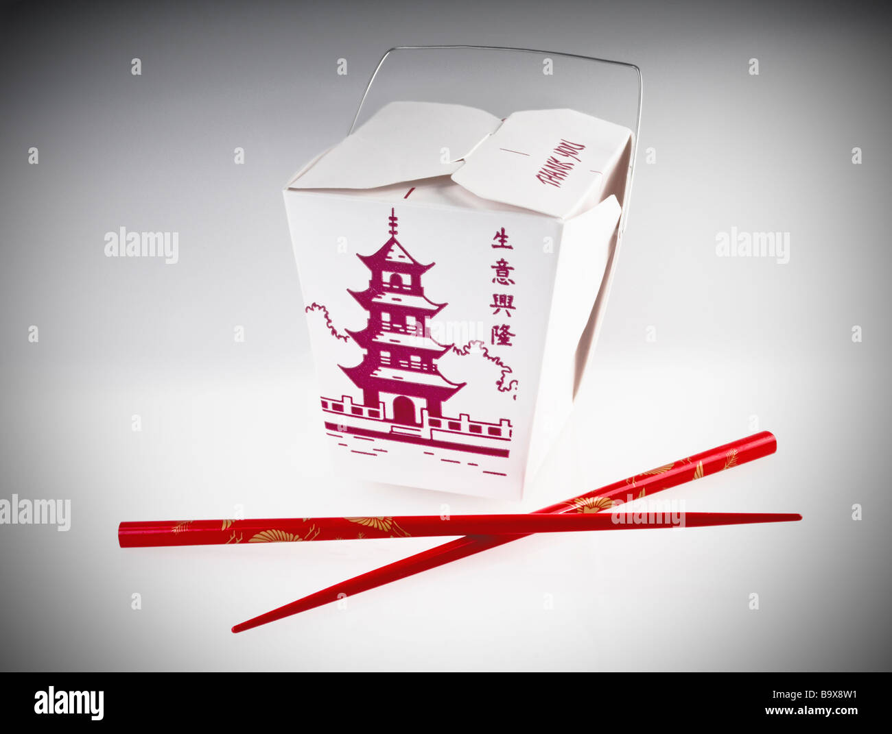 Chinese take-out carry out container and chopsticks on a white ...