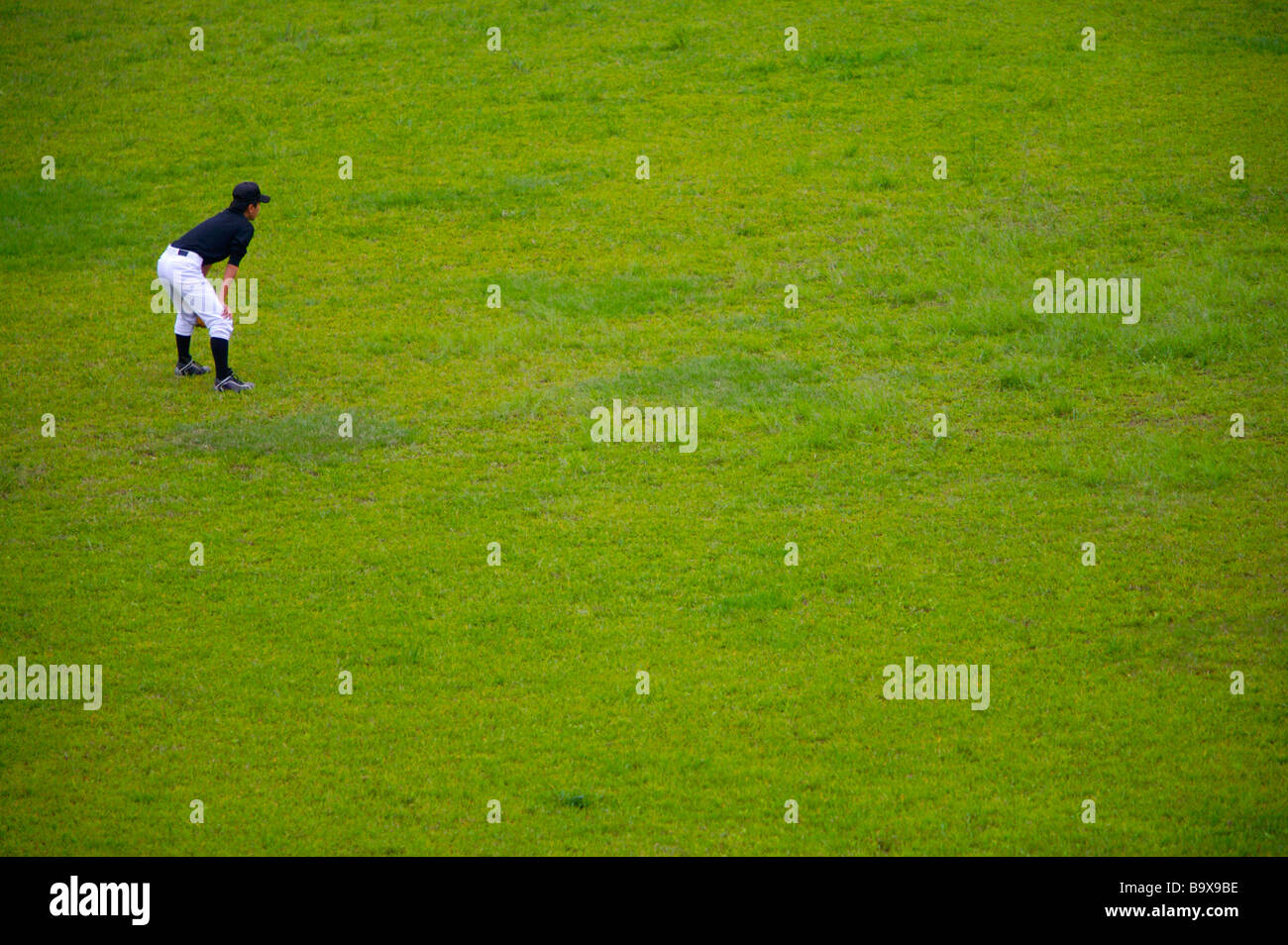 Baseball player bending in baseball diamond Stock Photo - Alamy