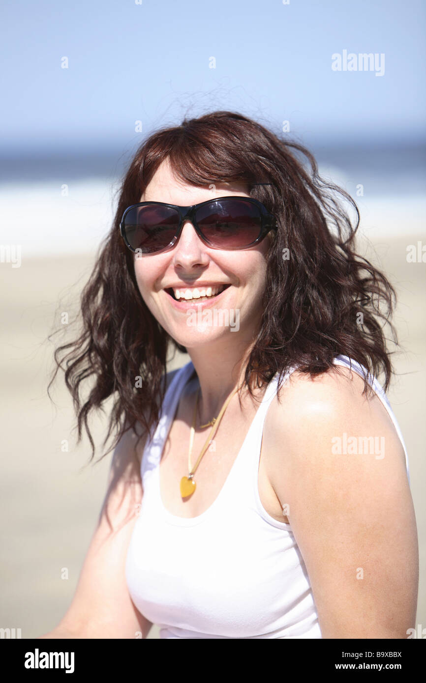 Portrait of woman at beach Stock Photo - Alamy