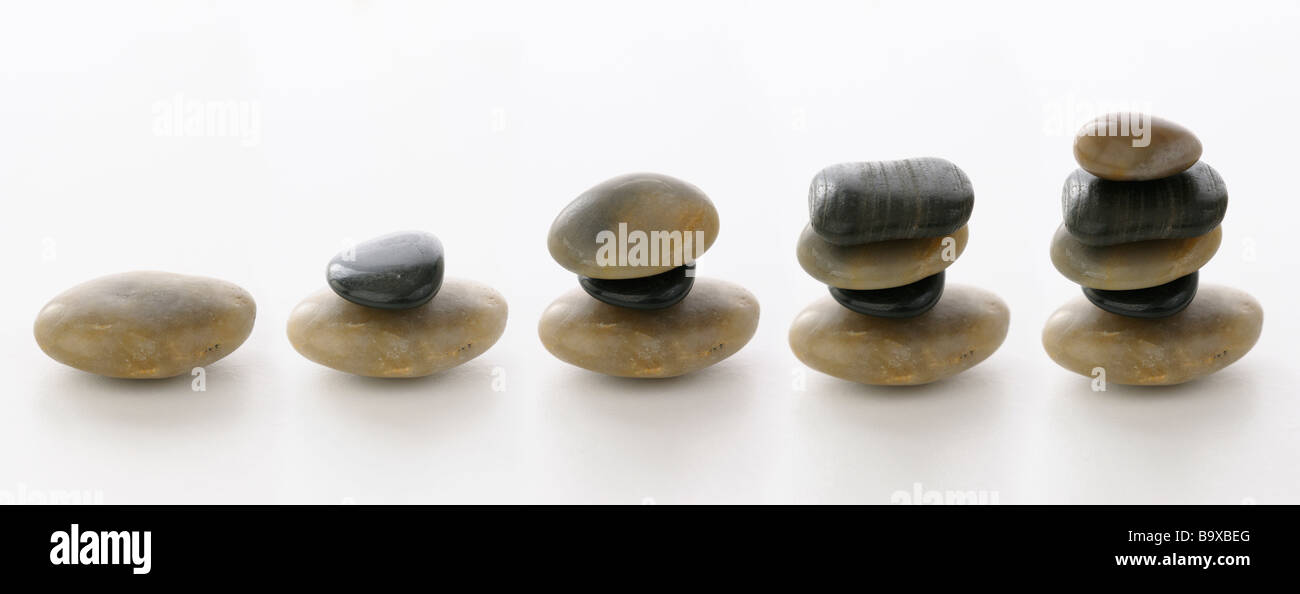 Panorama series of polished rocks stacked in a row into a Zen tower on ...