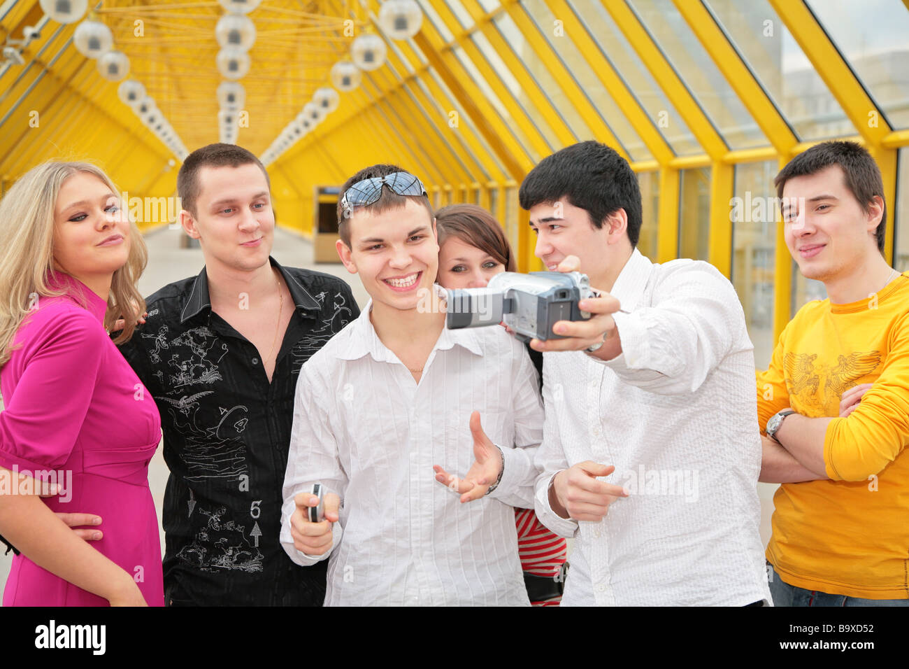 Boy filming friends hi-res stock photography and images - Alamy