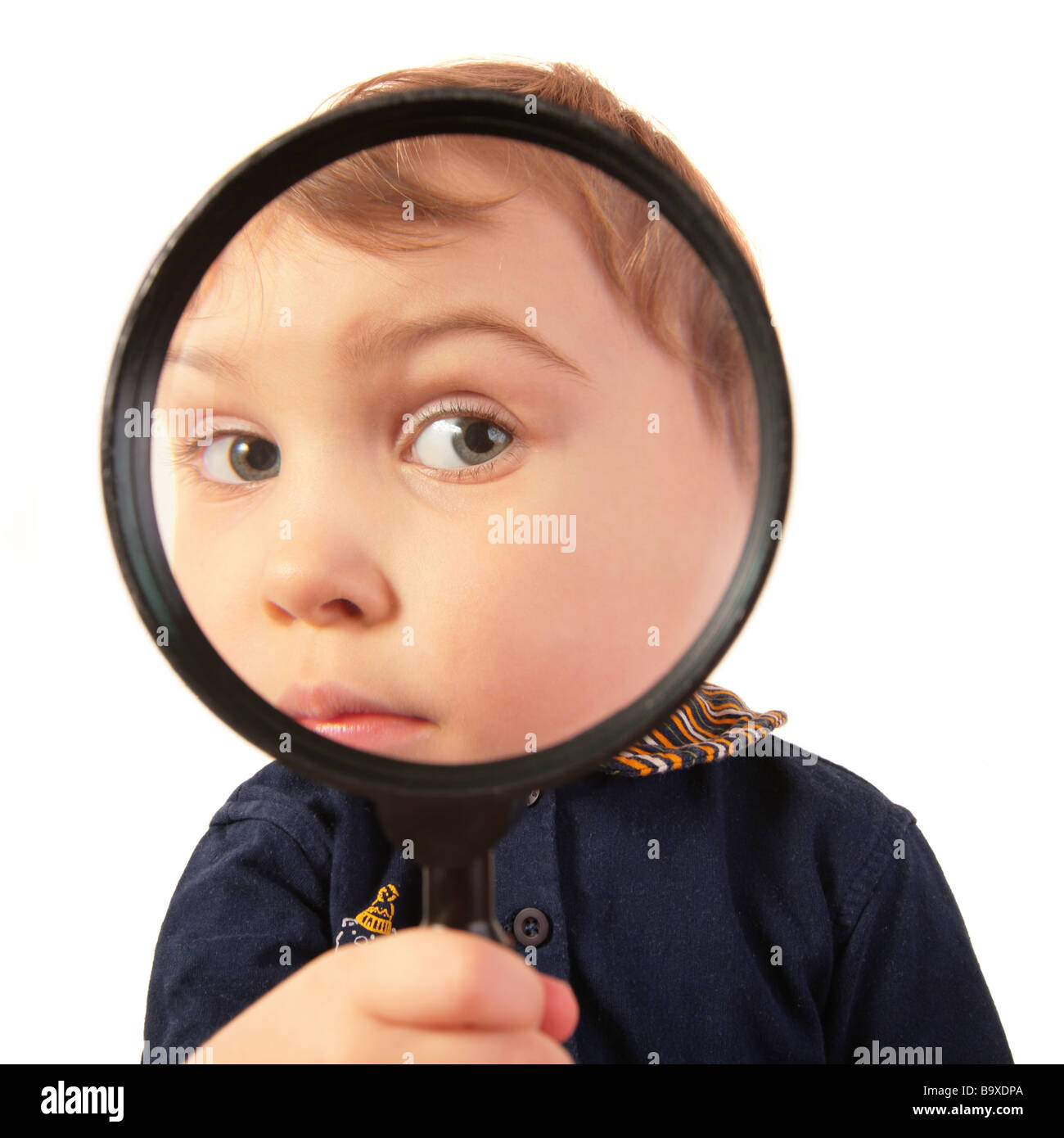 Child look through magnifier Stock Photo - Alamy