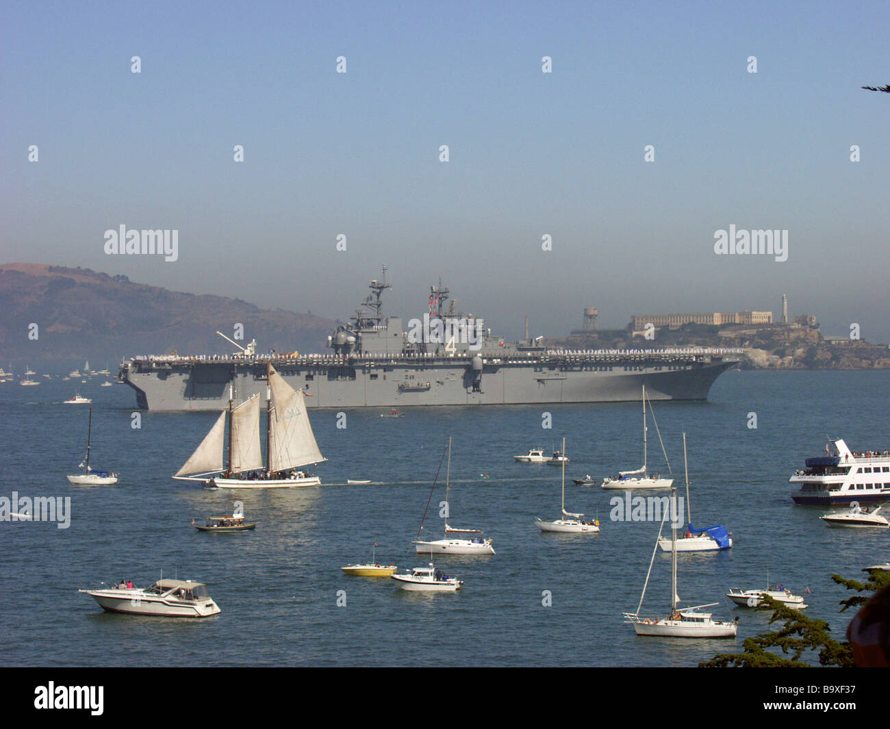 A US Navy Aircraft Carrier slips past Alcatraz island into San ...