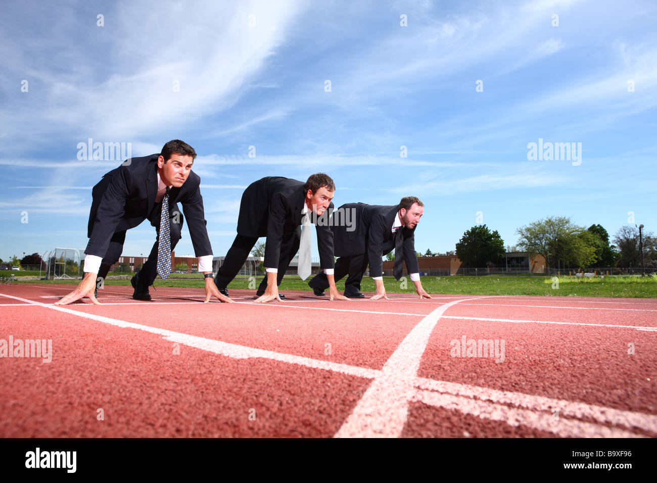 Businesspeople racing on track Stock Photo - Alamy