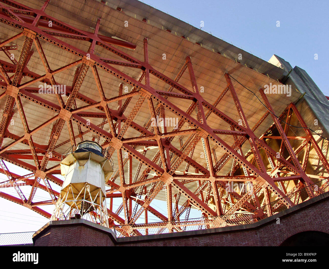 Old light house beacon on Fort Point underneath the arch of the Golden ...