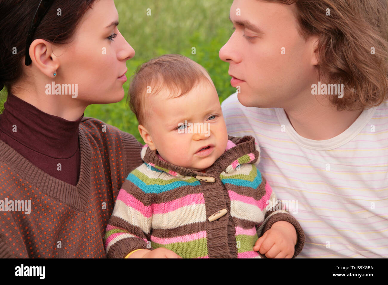 parents and baby faces Stock Photo - Alamy