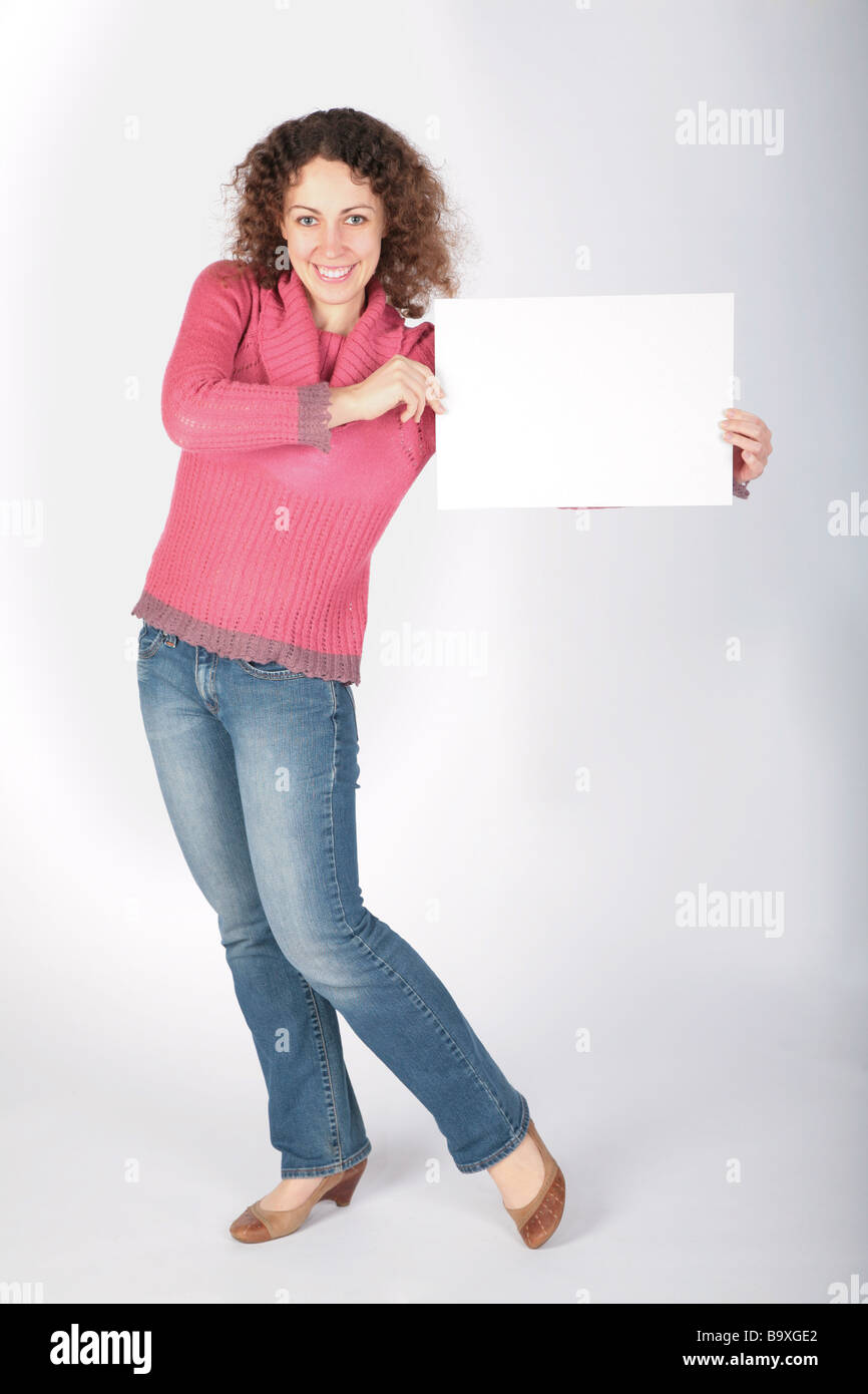 young woman stands and keep white sheet of paper Stock Photo - Alamy