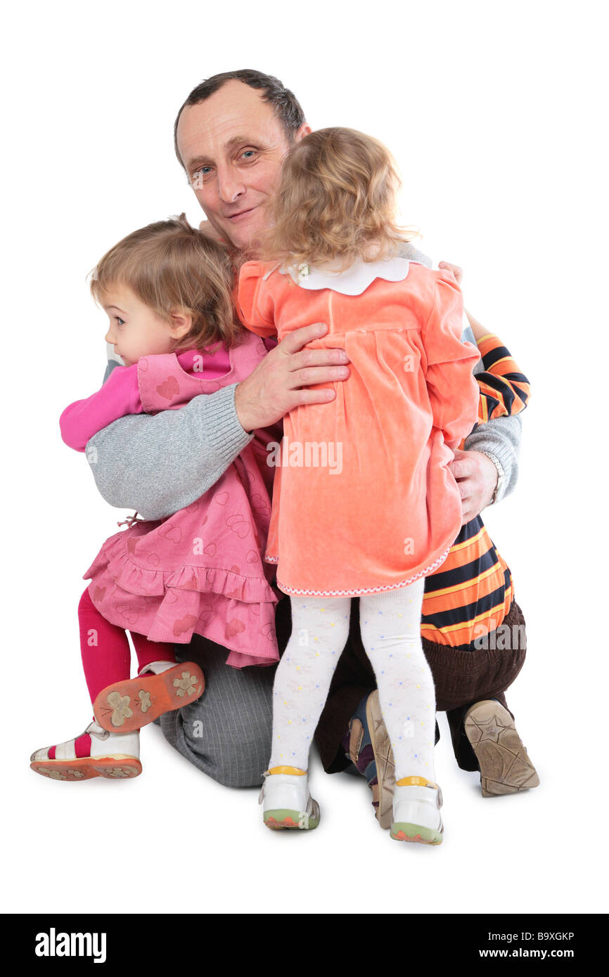 Man embrace three kids Stock Photo - Alamy