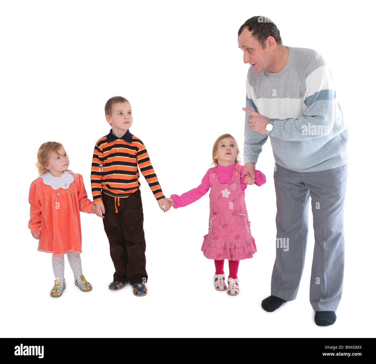 Man talking to three kids Stock Photo - Alamy