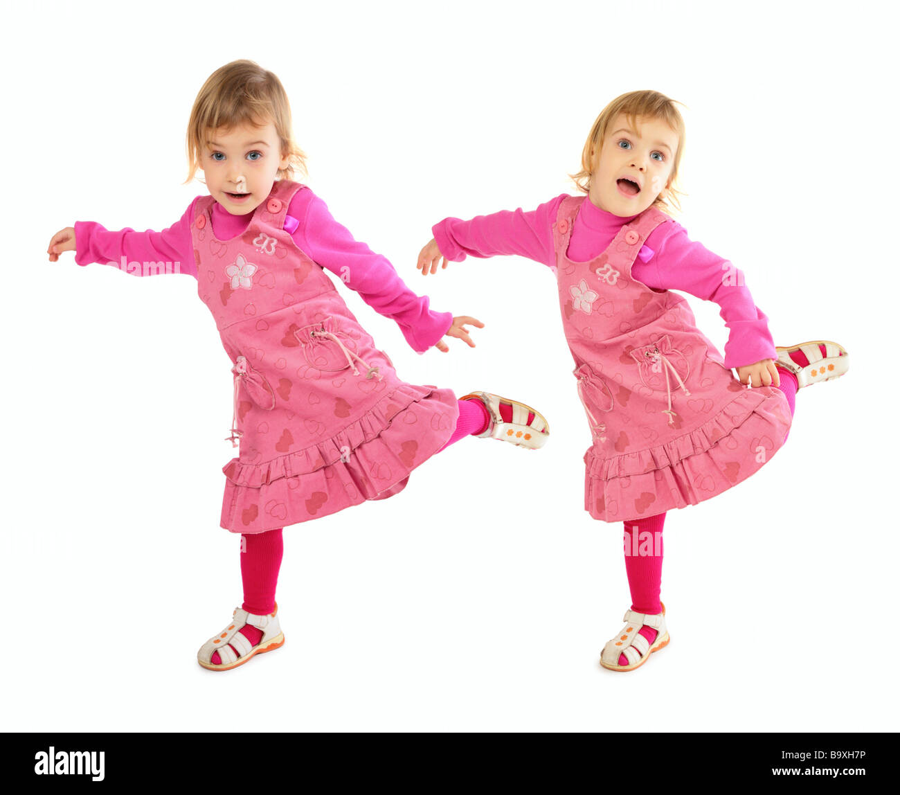 Little girl in pink dress dancing Stock Photo - Alamy