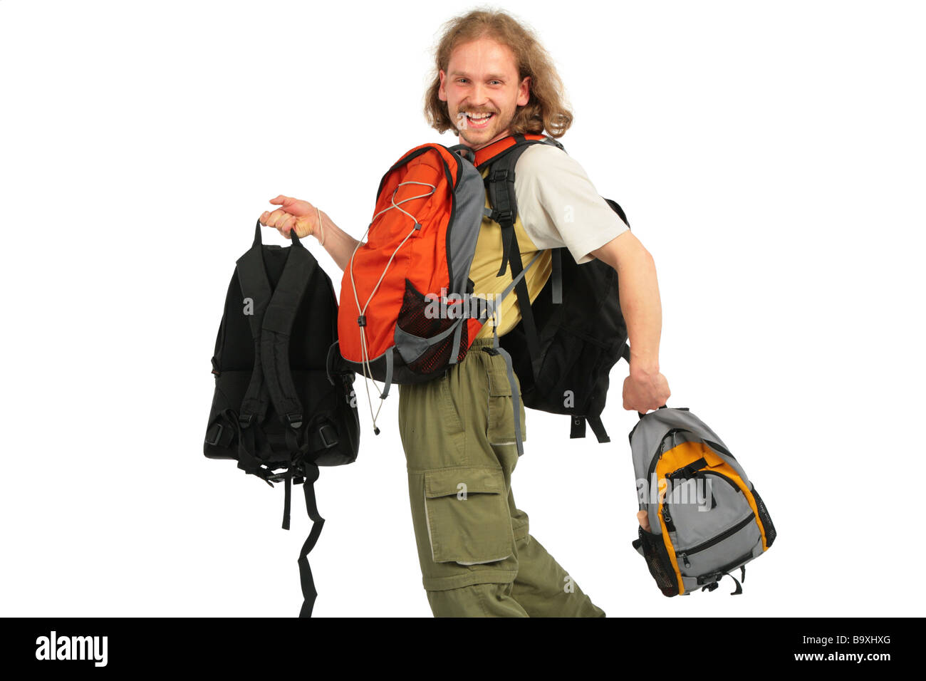 walking Man with many backpacks Stock Photo - Alamy