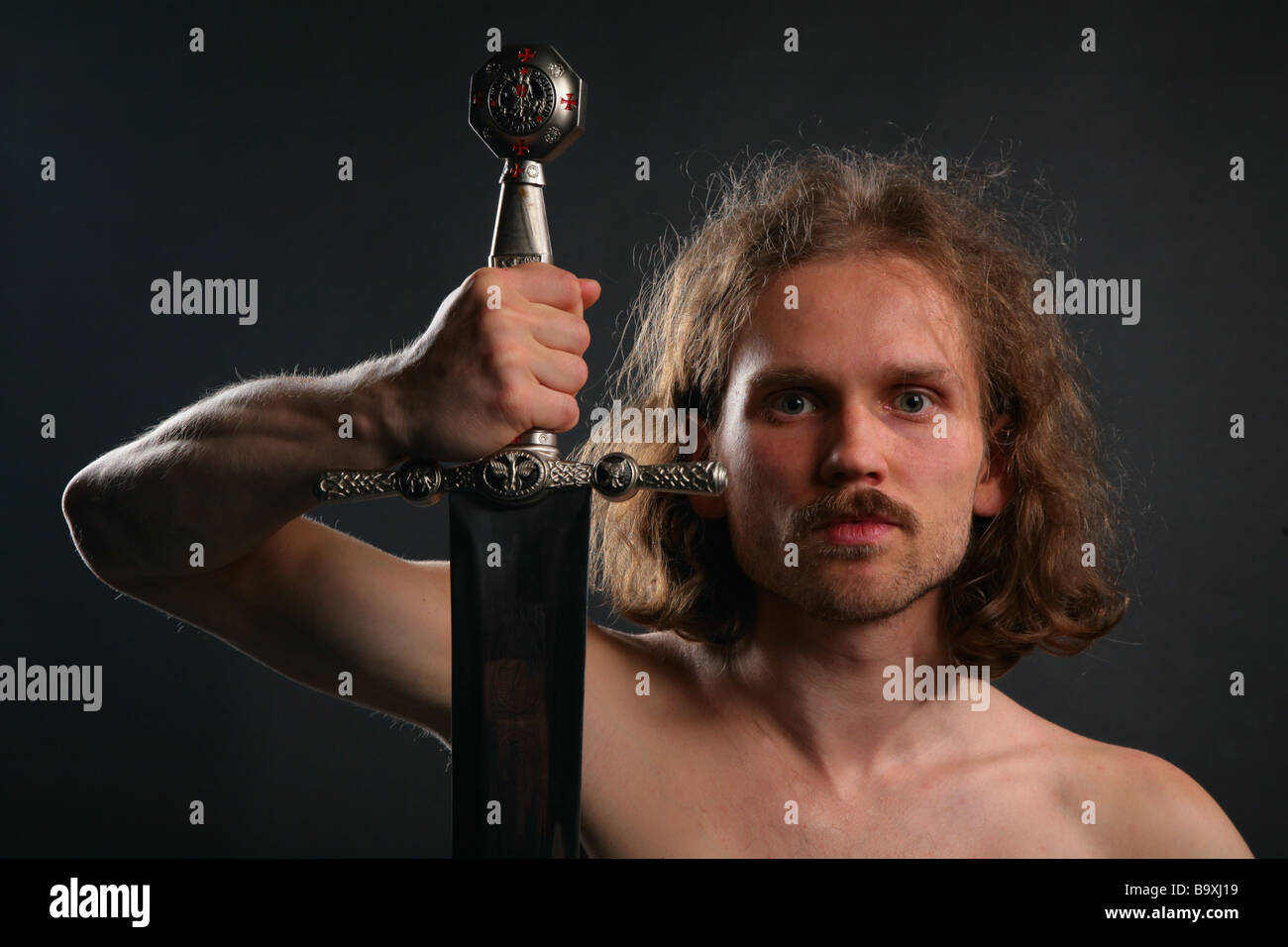 Man with sword Stock Photo - Alamy