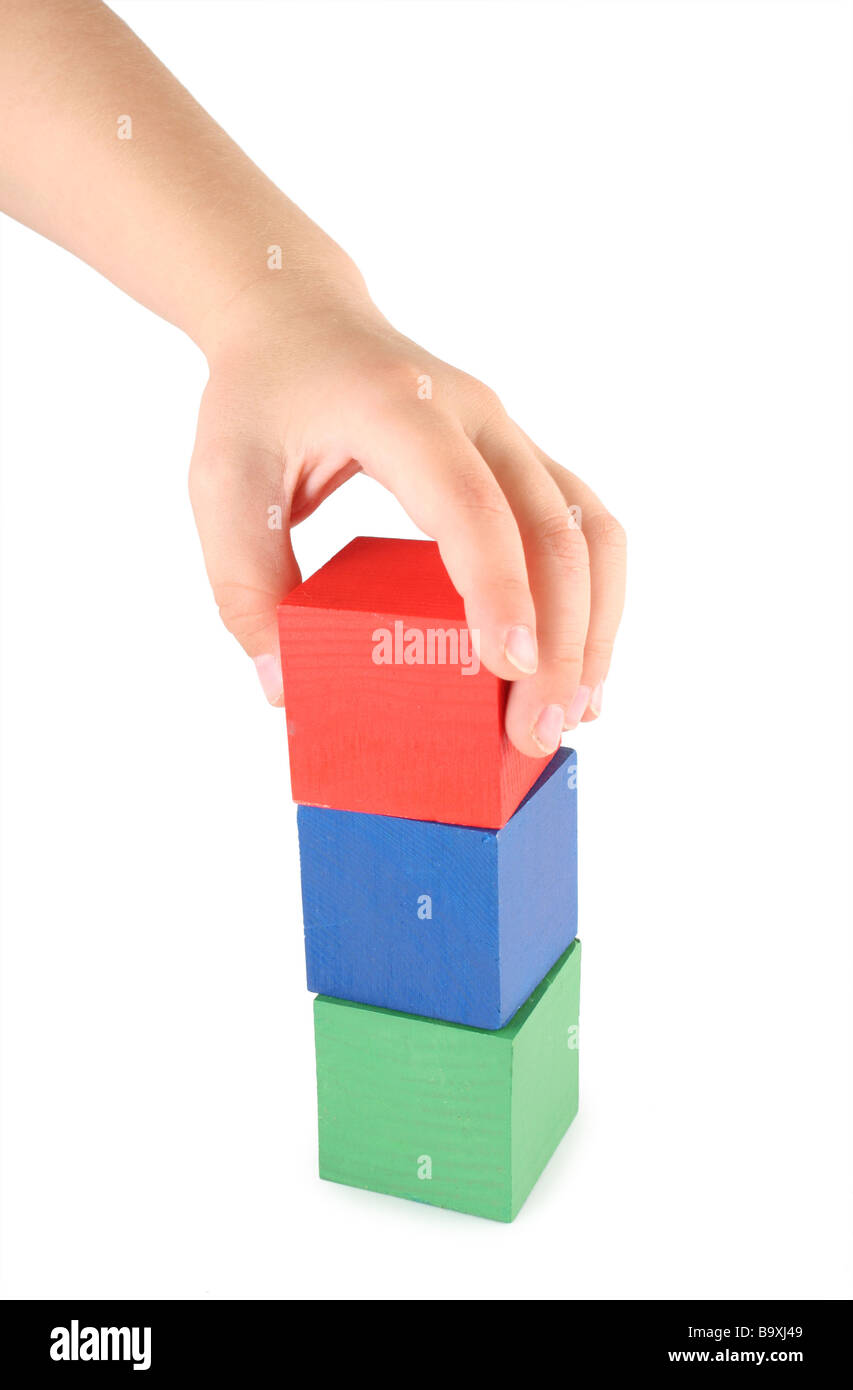 Children's hand and toy cubes Stock Photo - Alamy