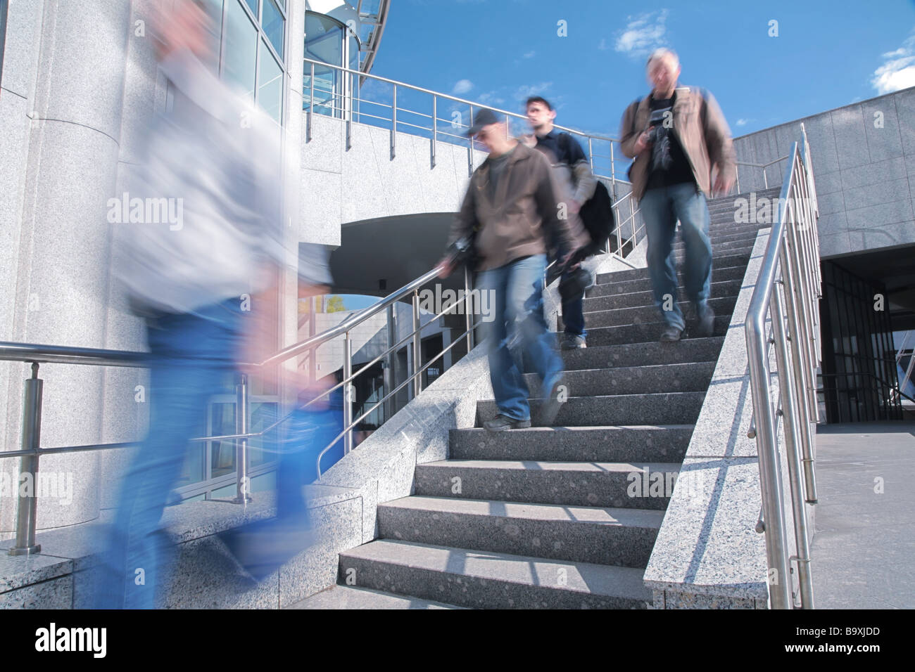 People go down on concrete ladder Stock Photo - Alamy