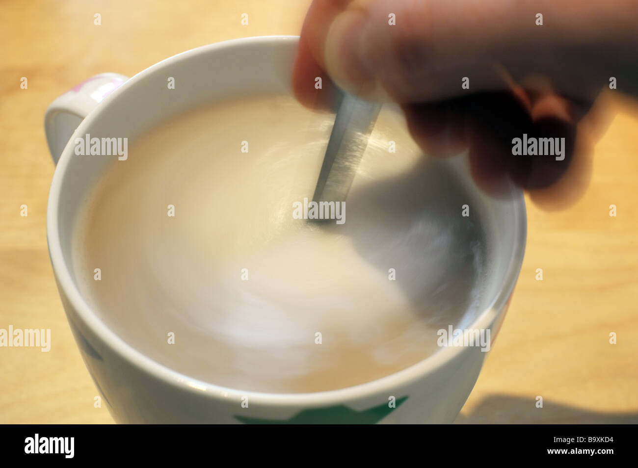 Stirring sugar hi-res stock photography and images - Alamy