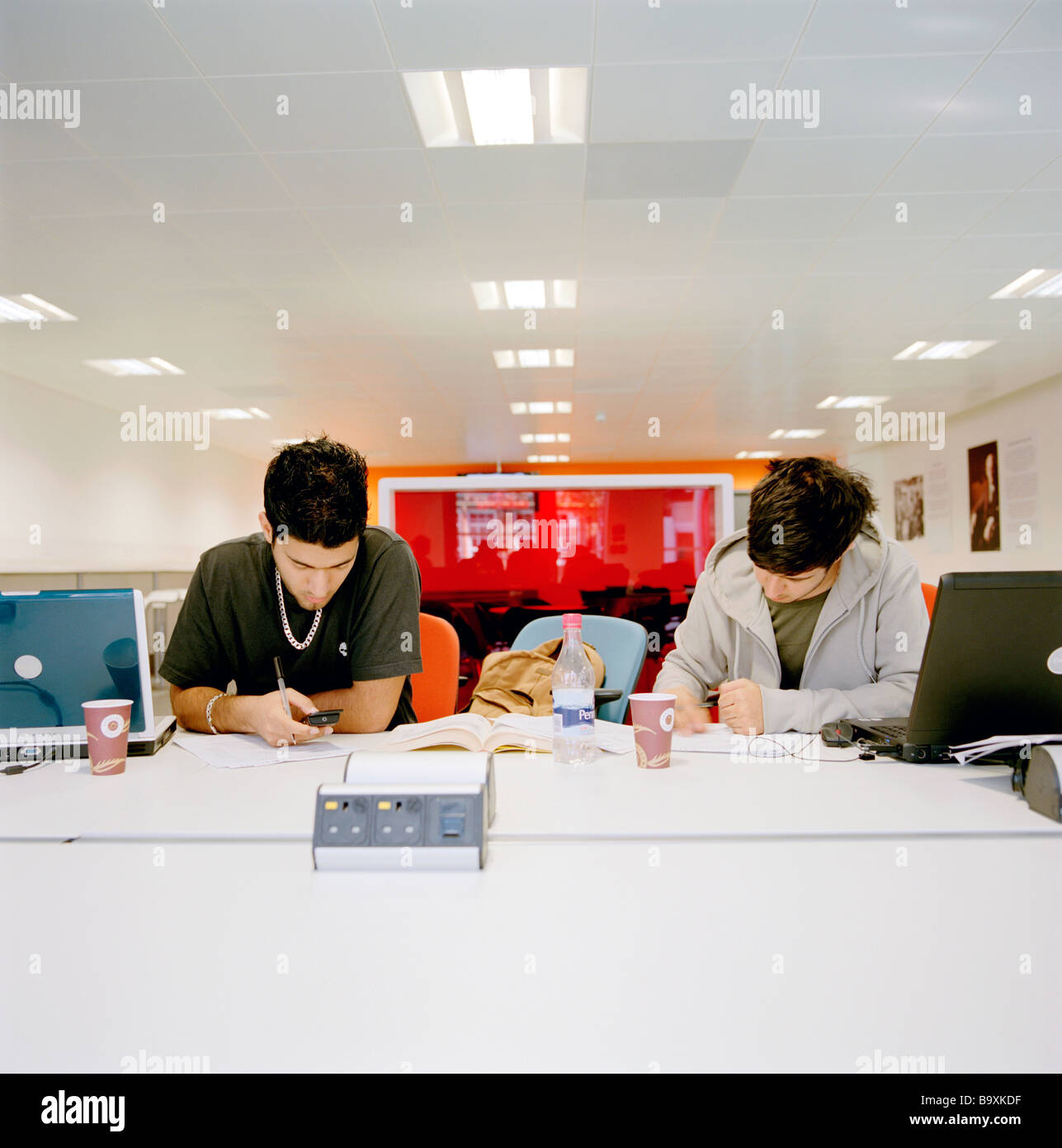 young boy, male working on computer, studying, revising for exams ...