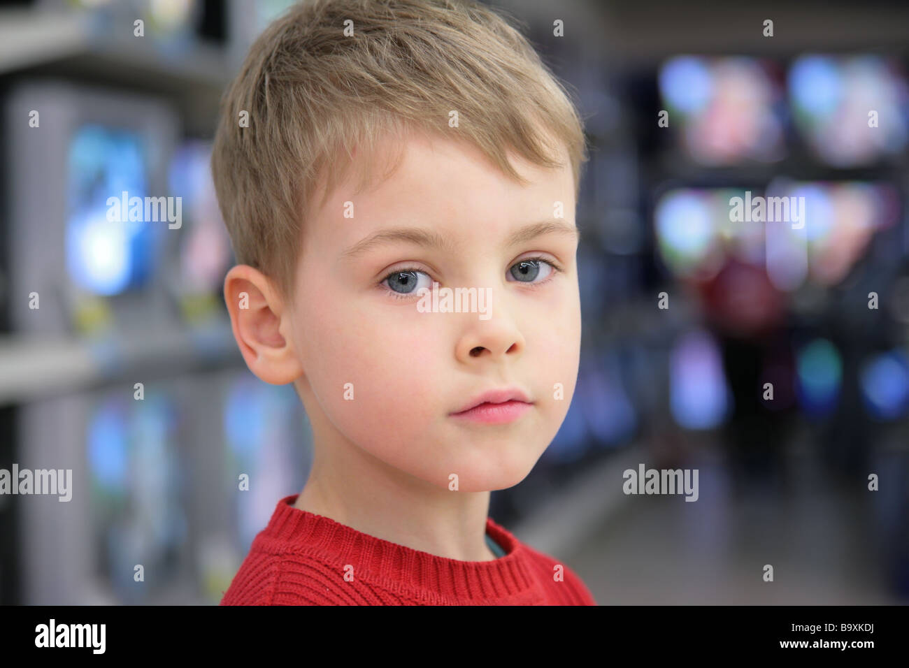 portrait of boyon tv background Stock Photo - Alamy
