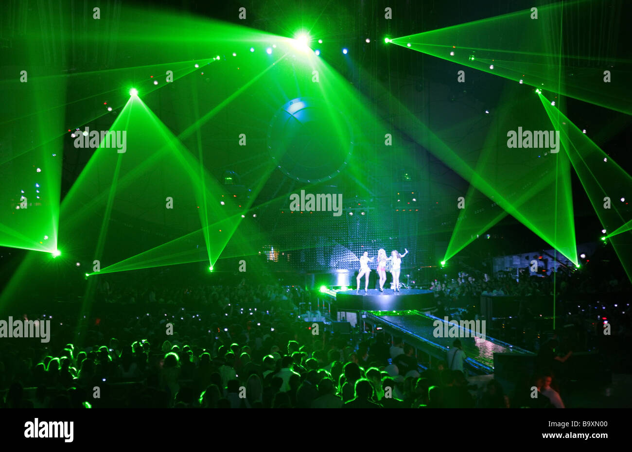 actress on stage. laser beams. concert Stock Photo - Alamy