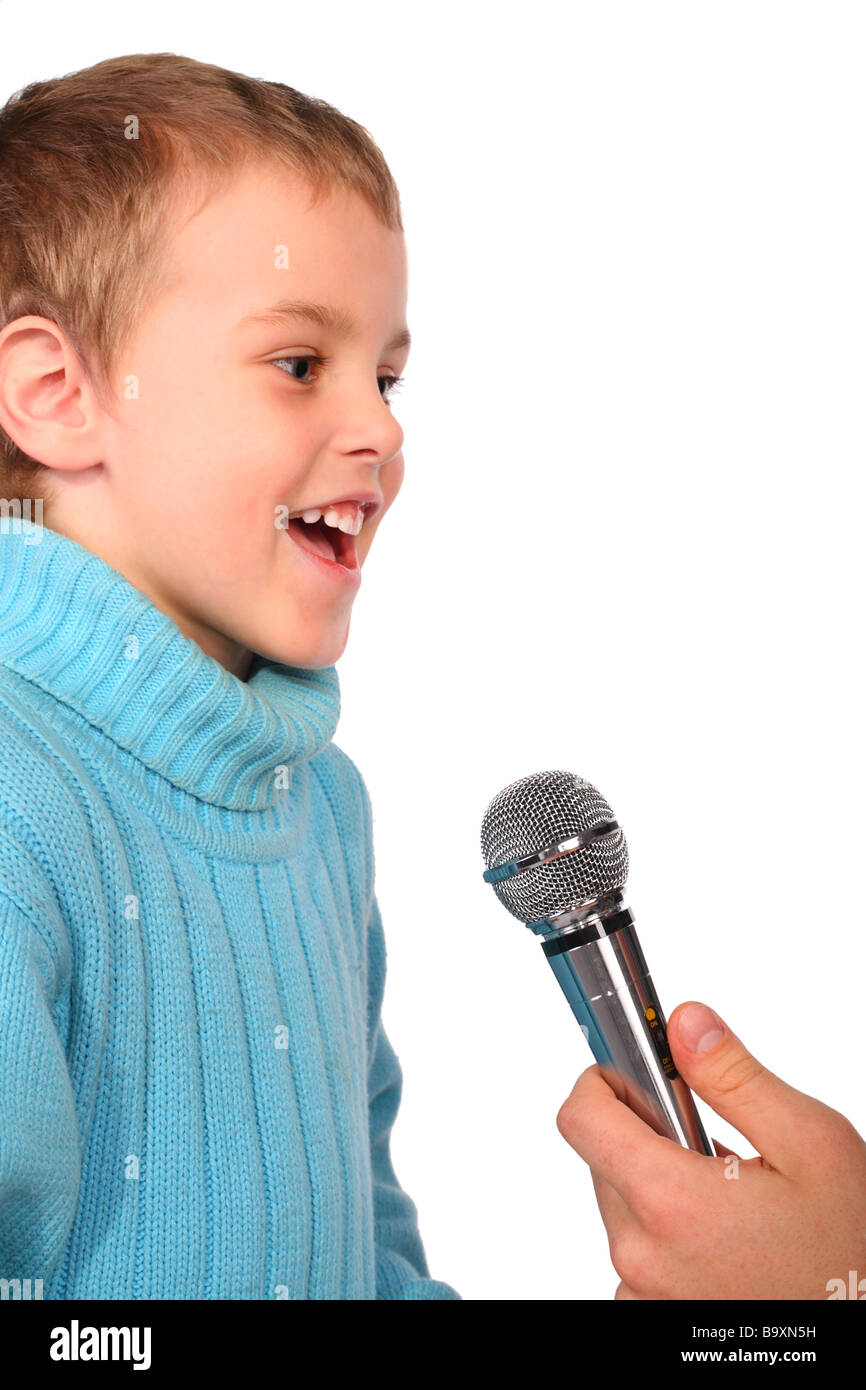 boy sings into microphone Stock Photo - Alamy