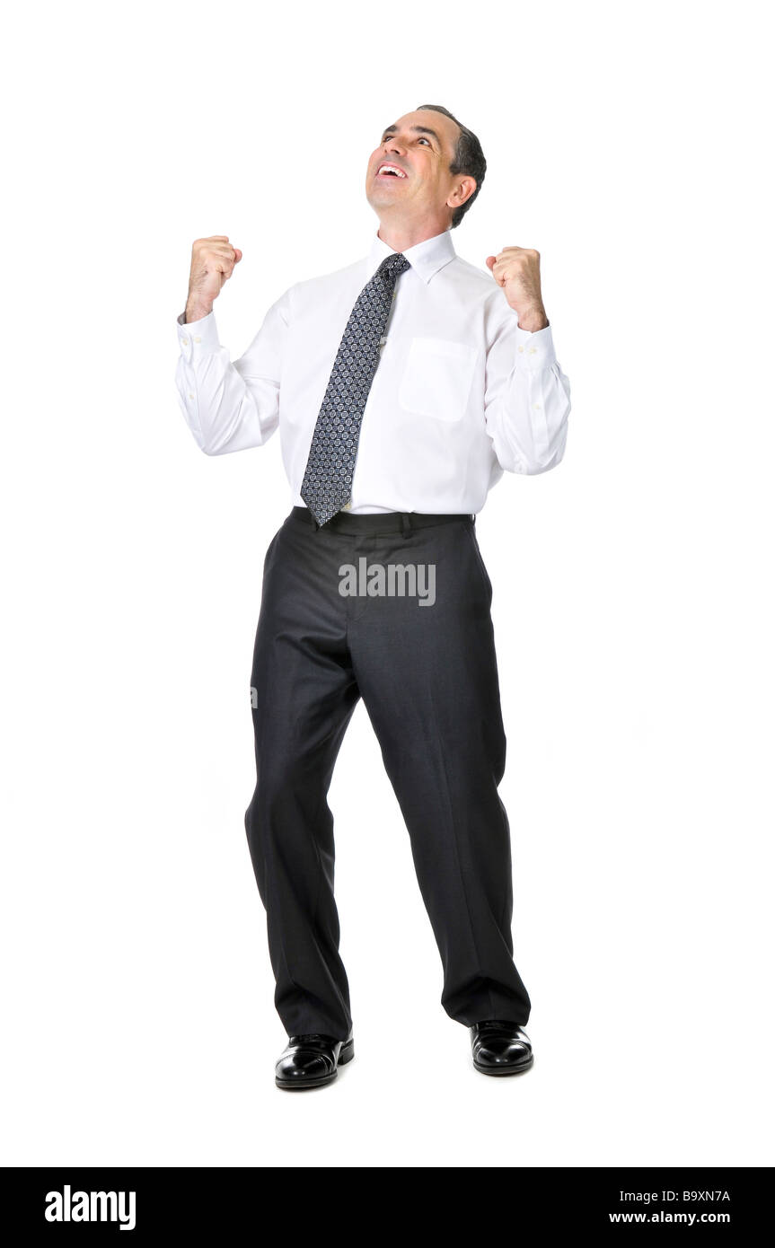 Happy celebrating business man in suit isolated on white background ...