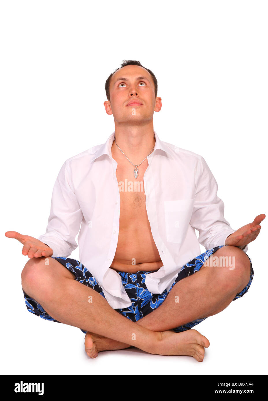 man sitting in pose of lotus Stock Photo - Alamy