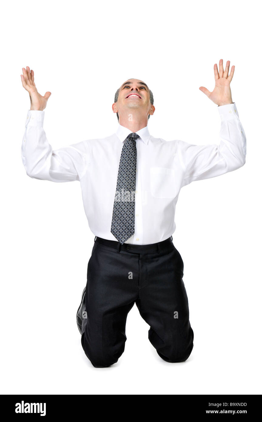 Happy celebrating business man in suit isolated on white background ...