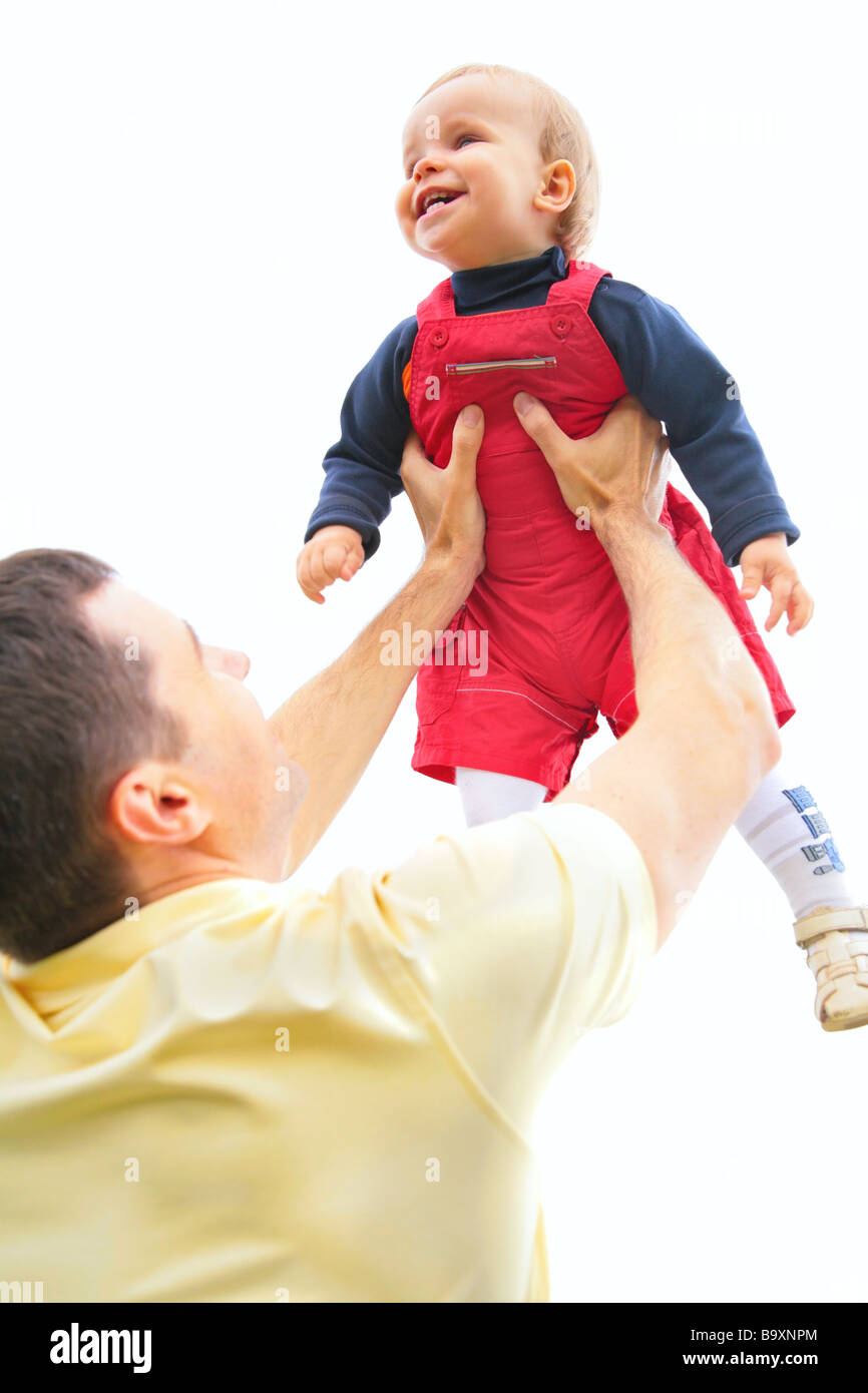 father lifts son on hands Stock Photo - Alamy