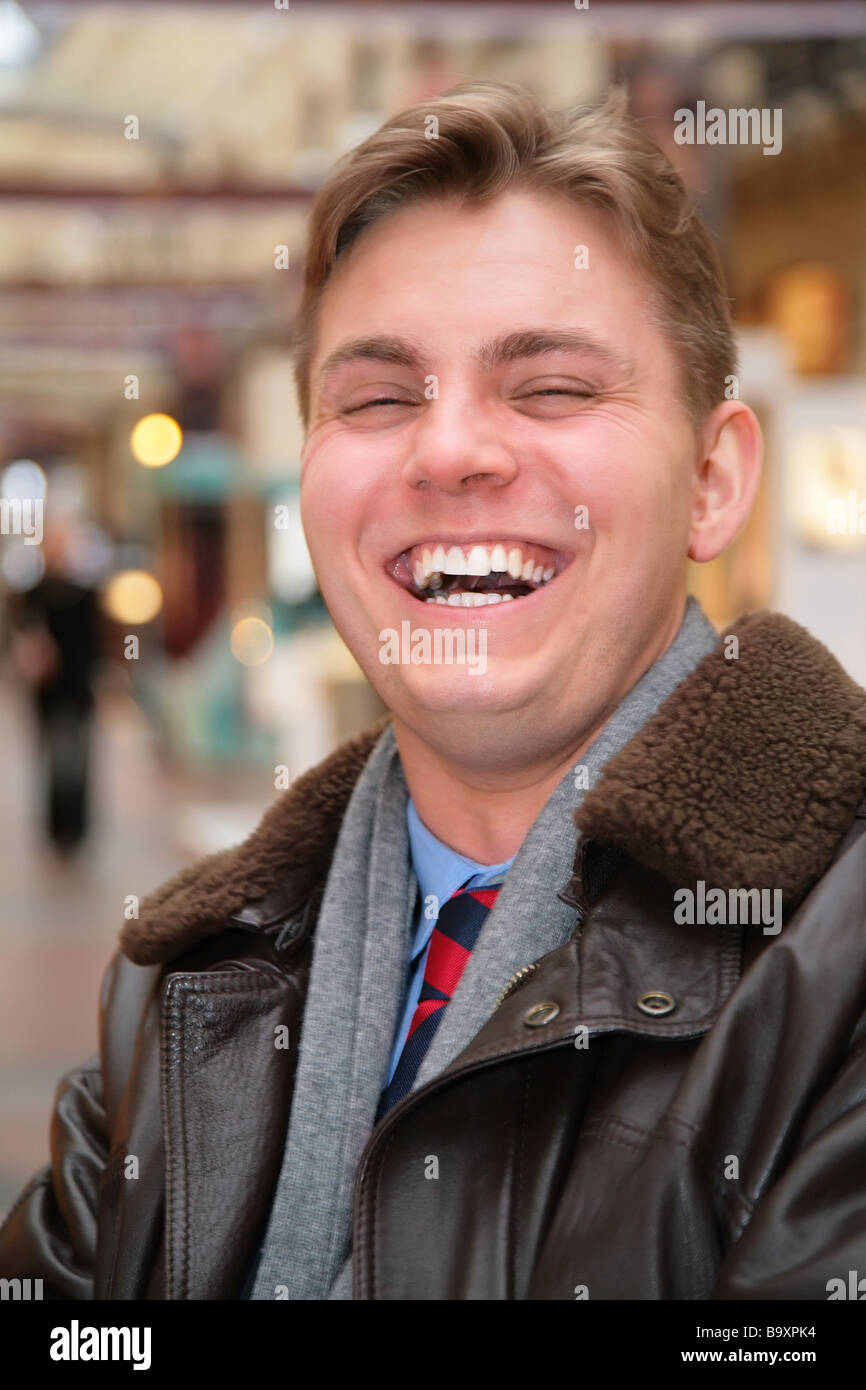 laughing man in leather jacket Stock Photo - Alamy