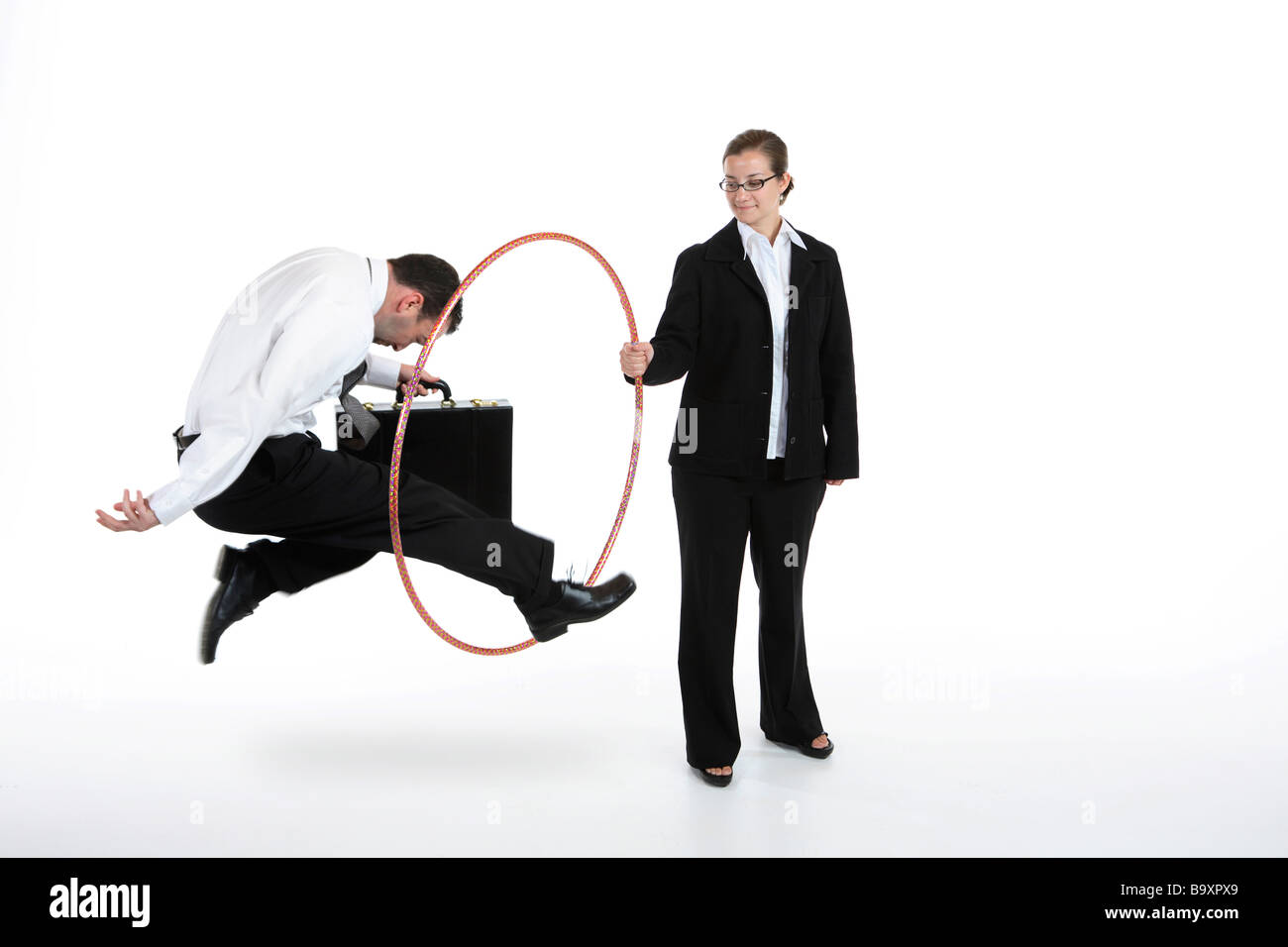 Businessman jumping through hoop isolated on white Stock Photo - Alamy