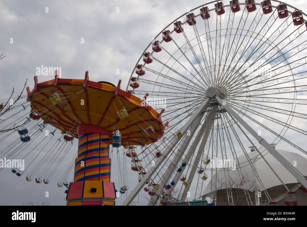 Ferris wheel and wave swinger on Navy Pier Chicago USA Stock Photo - Alamy