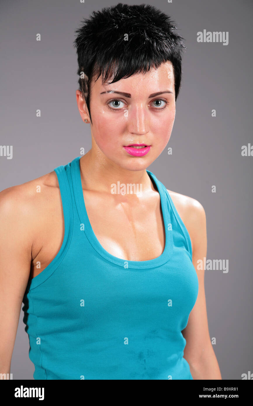beauty young sweaty woman in blue t-shirt Stock Photo - Alamy