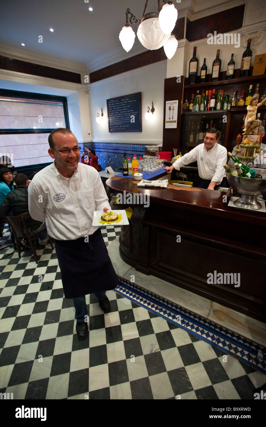 Waiter Delivering Pepper con Queso Tapa at Bar Europa in Seville Spain ...