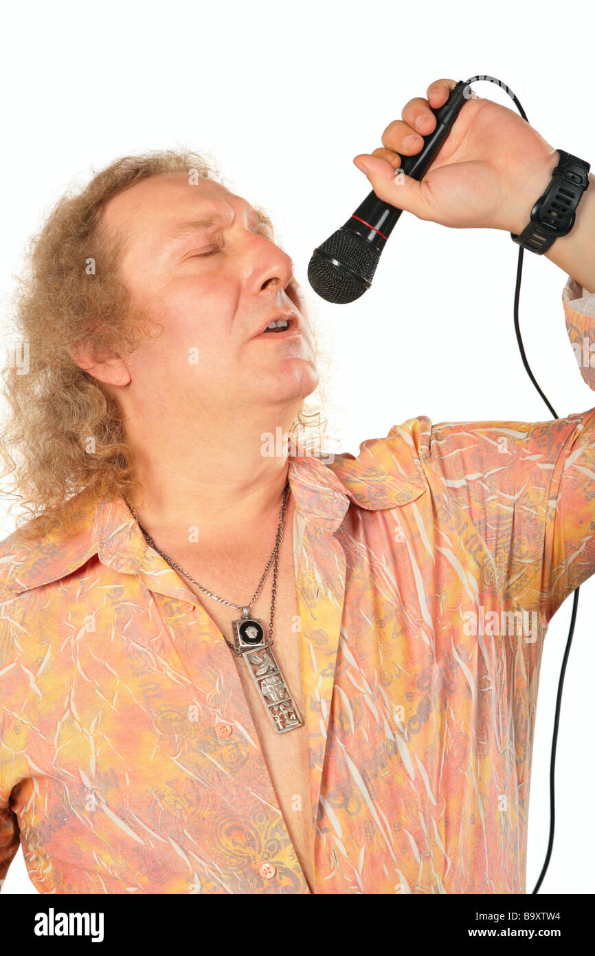 Mature man with microphone Stock Photo - Alamy