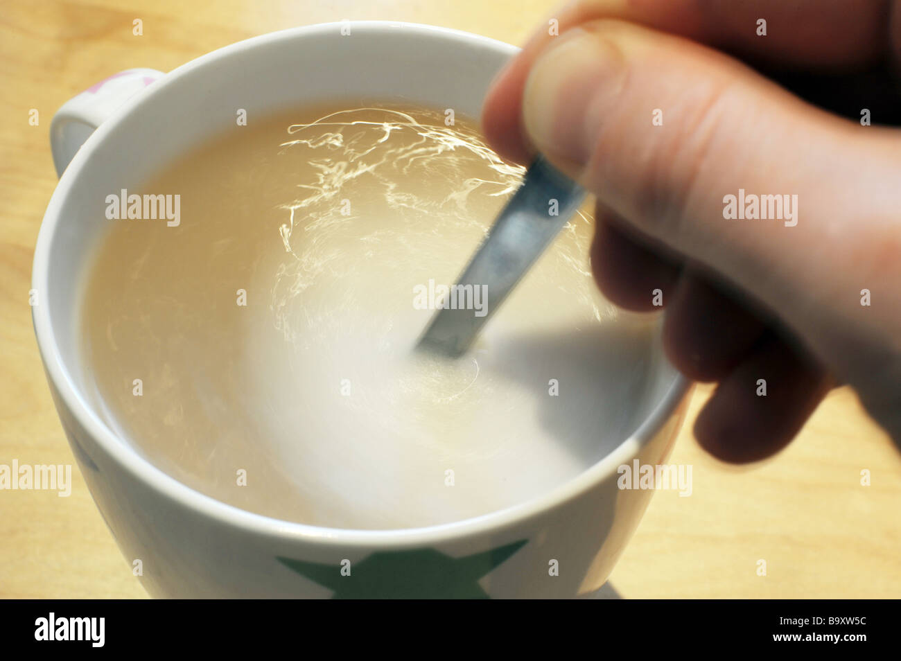 Stirring sugar hi-res stock photography and images - Alamy