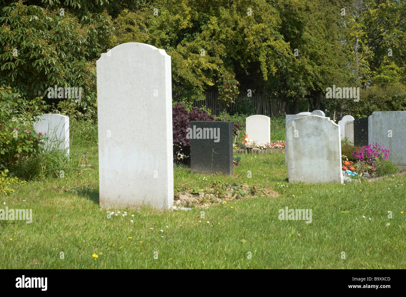 Gravestones in a grave yard in England Stock Photo - Alamy
