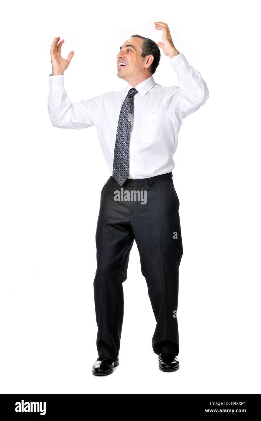 Happy celebrating business man in suit isolated on white background ...