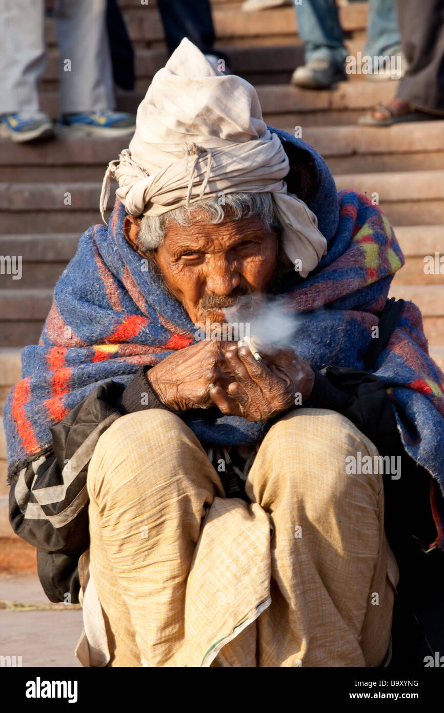 Homeless Man Smoking in Delhi India Stock Photo - Alamy