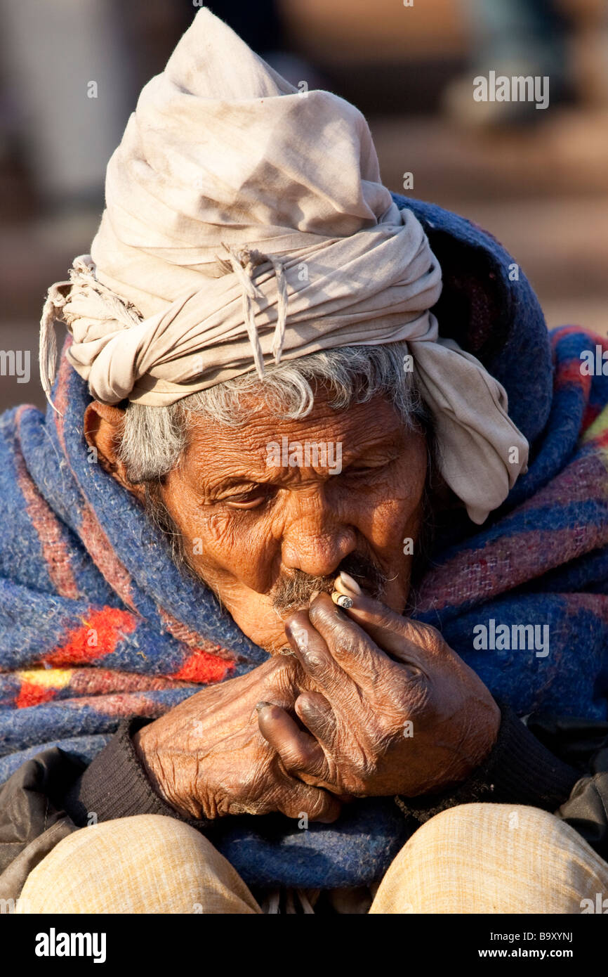 Homeless Man Smoking in Delhi India Stock Photo - Alamy