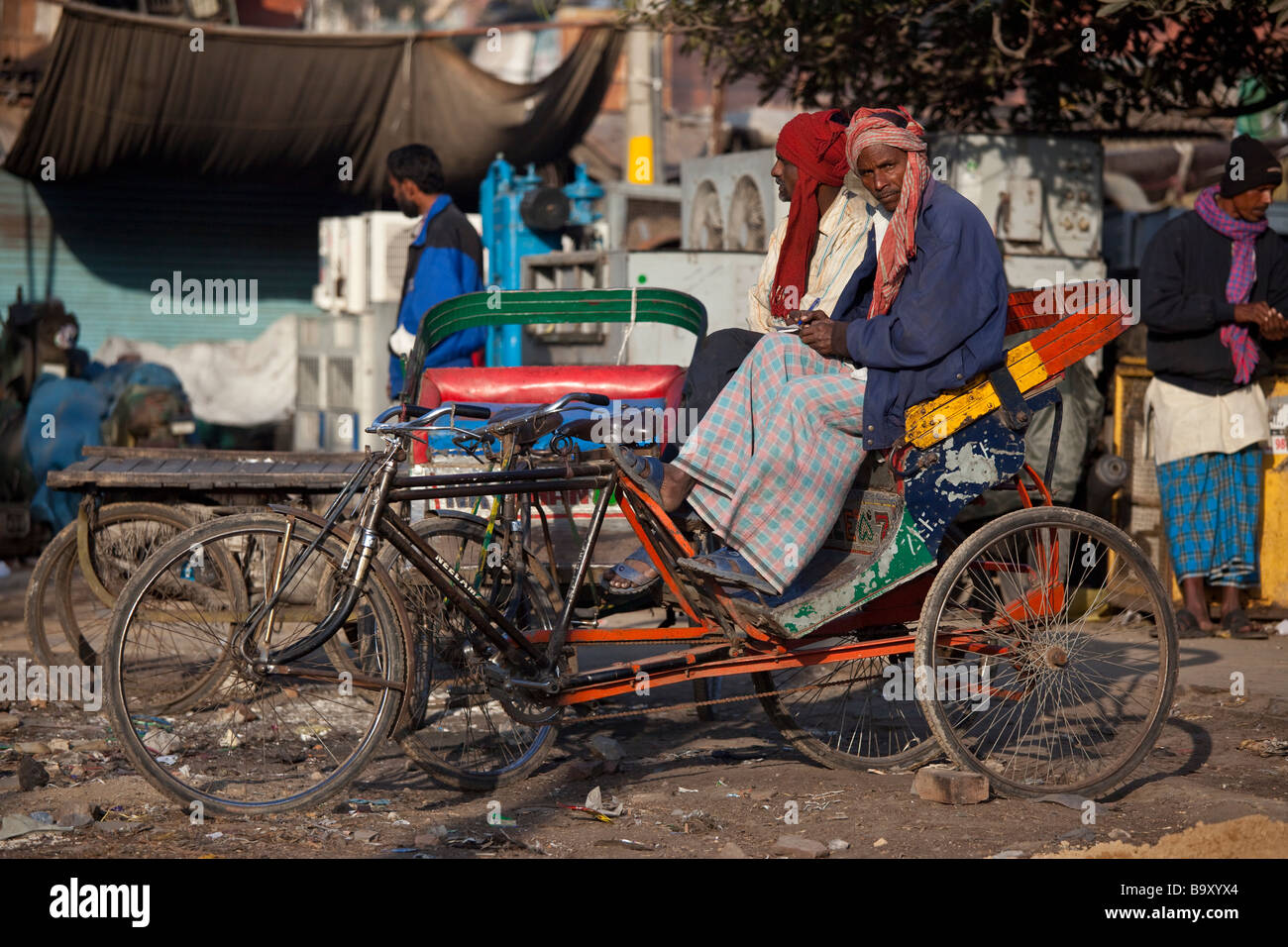 Bicycle Rickshaw Drivers at Rest in Delhi India Stock Photo - Alamy