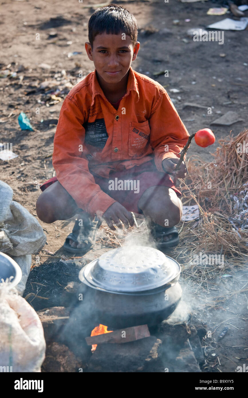 Boy Cooking Over an Open Fire in Delhi India Stock Photo - Alamy