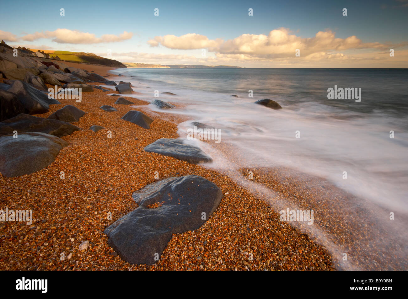 Waves rushing in over shingle beach at Beesands on the South Hams ...